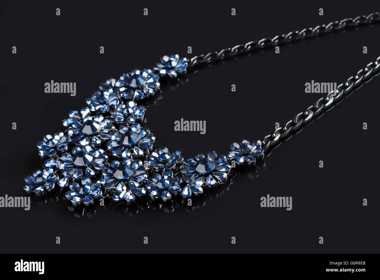 blue necklace on a black background. gems Stock Photo - Alamy