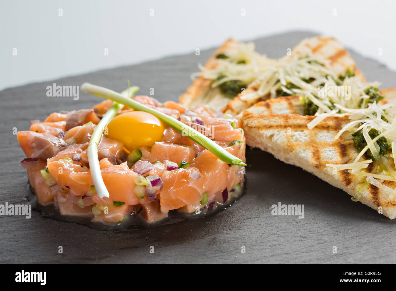fish tartare with quail egg Stock Photo - Alamy