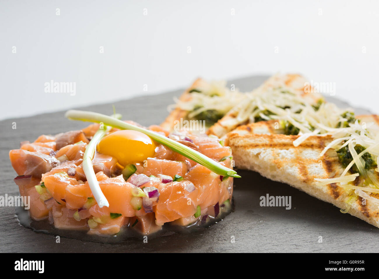 fish tartare with quail egg Stock Photo - Alamy