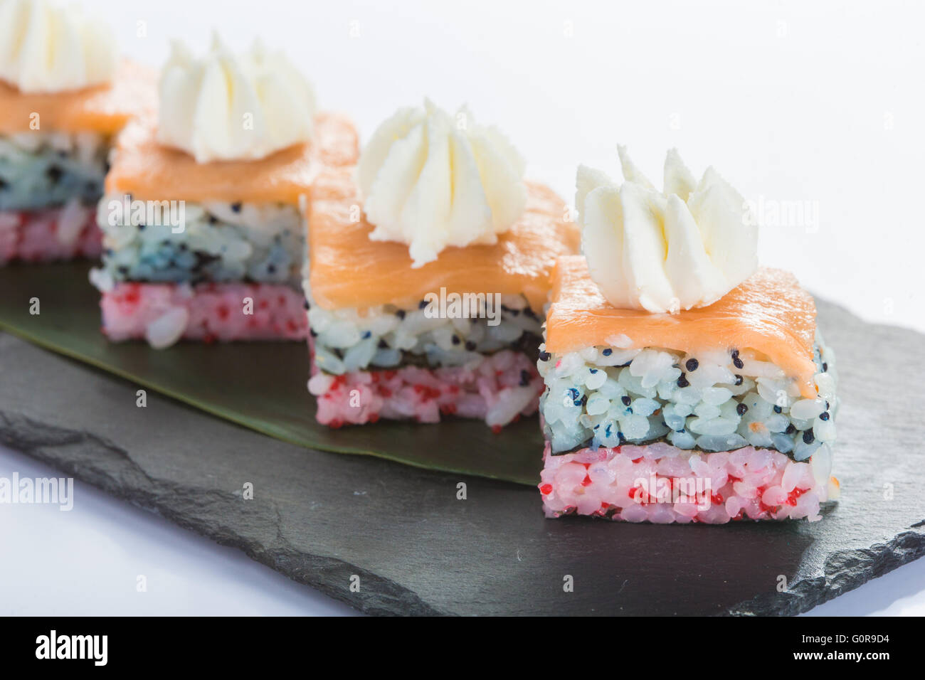 set of sushi on a slate square plate Stock Photo - Alamy