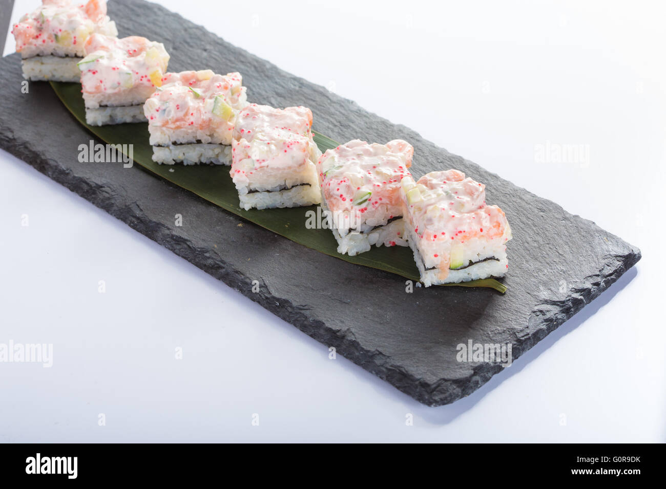 set of sushi on a slate square plate Stock Photo - Alamy