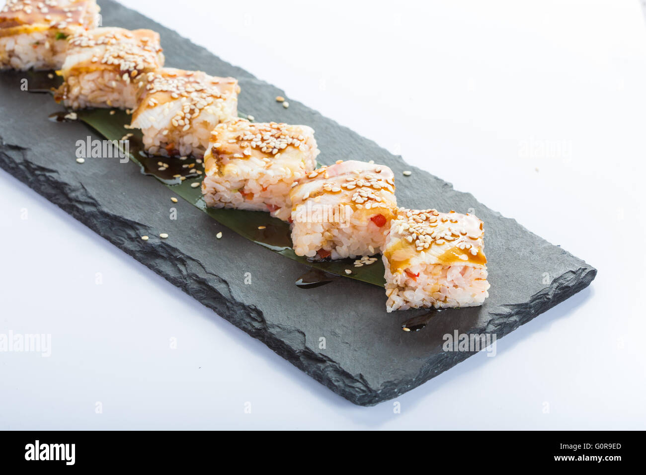 set of sushi on a slate square plate Stock Photo - Alamy