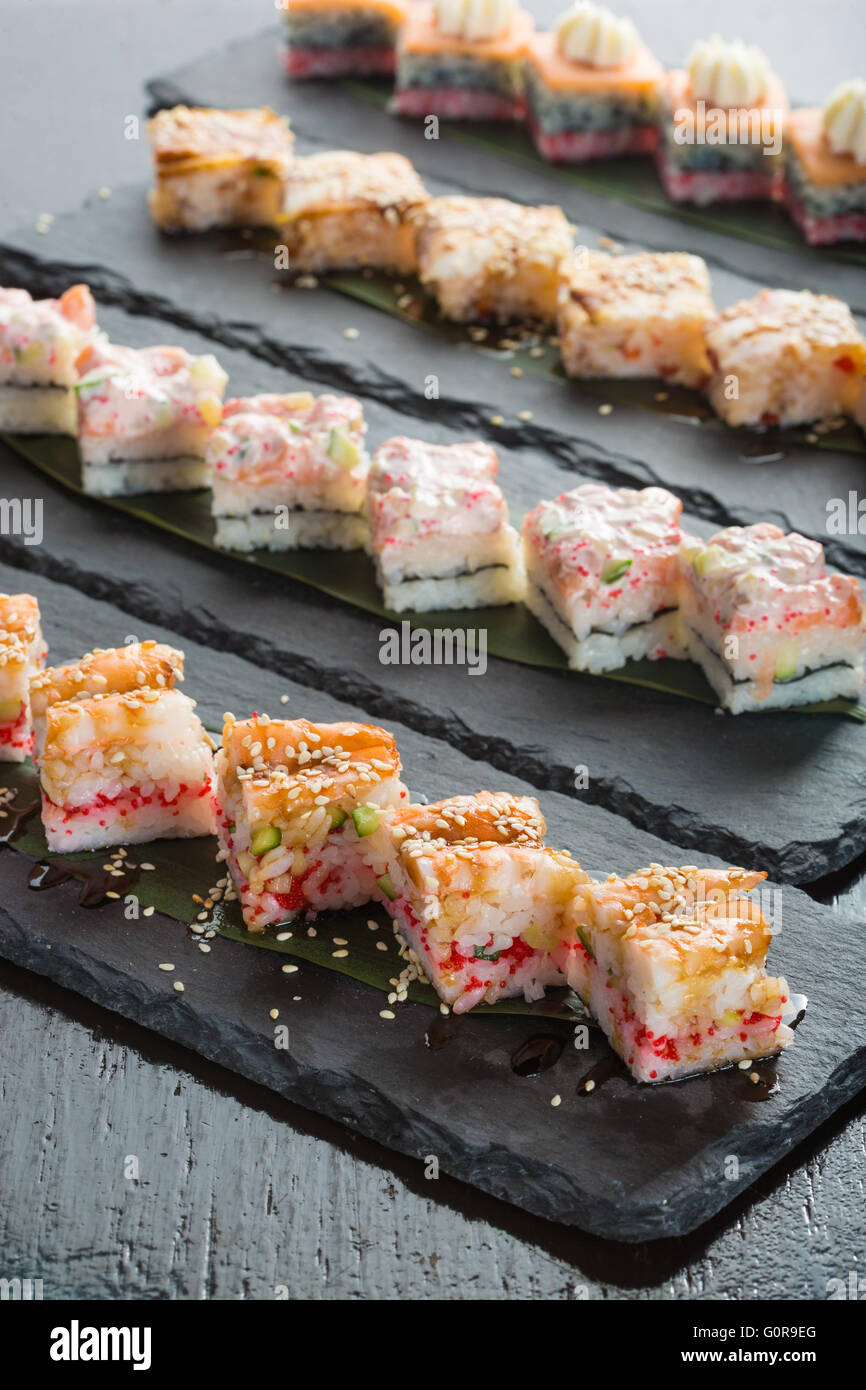set of sushi on a slate square plate Stock Photo - Alamy