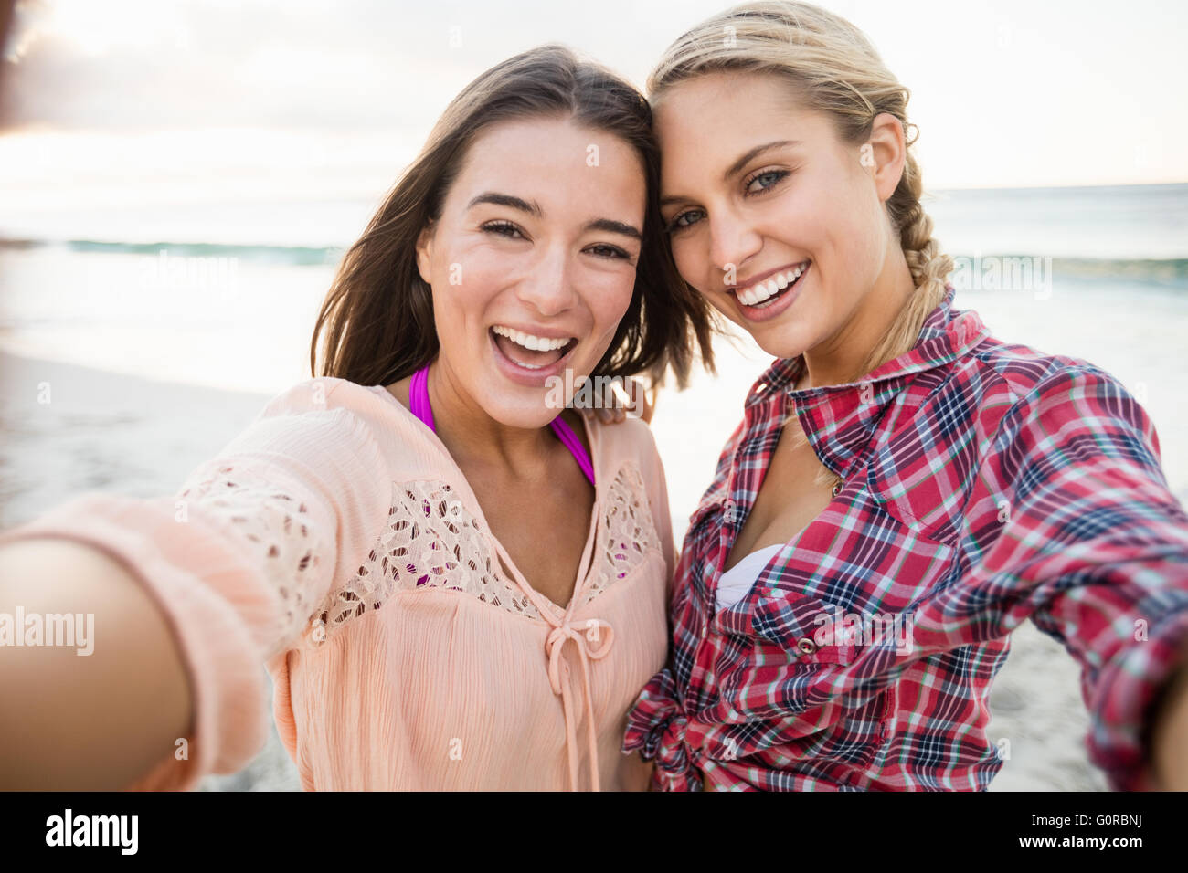 Smiling friends taking a selfie Stock Photo - Alamy