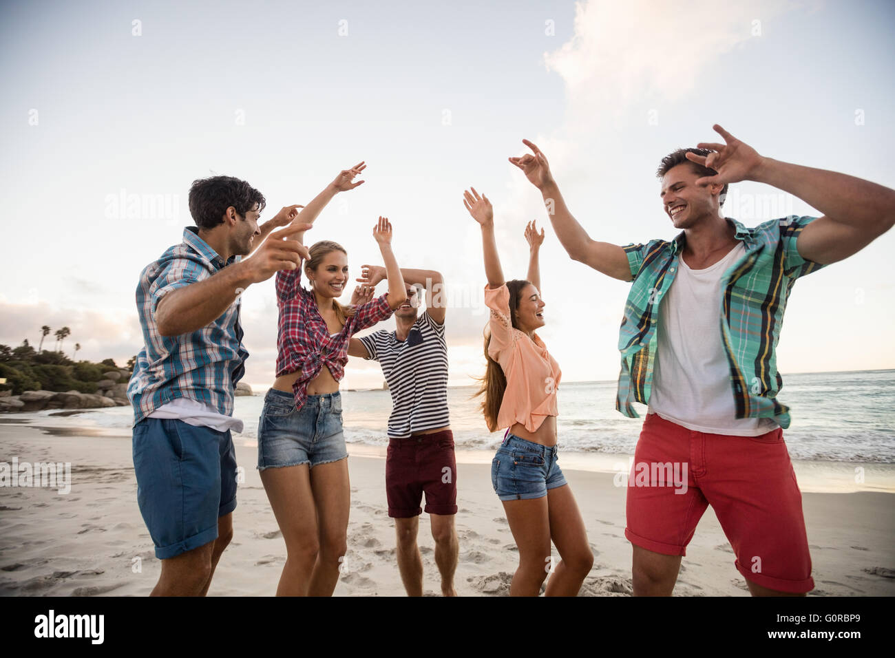 Friends having fun and dancing Stock Photo - Alamy