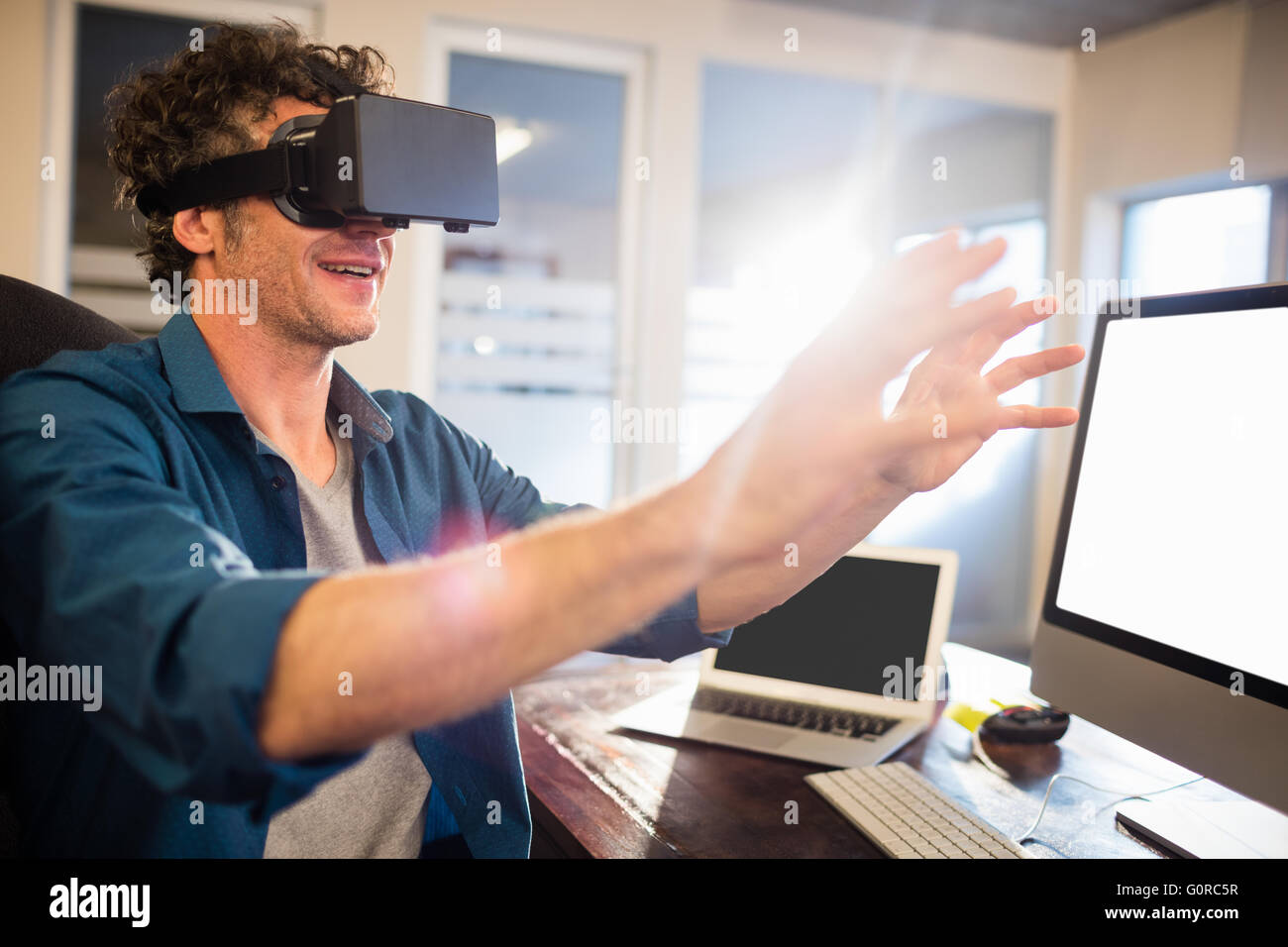 Businessman wearing virtual glasses Stock Photo - Alamy