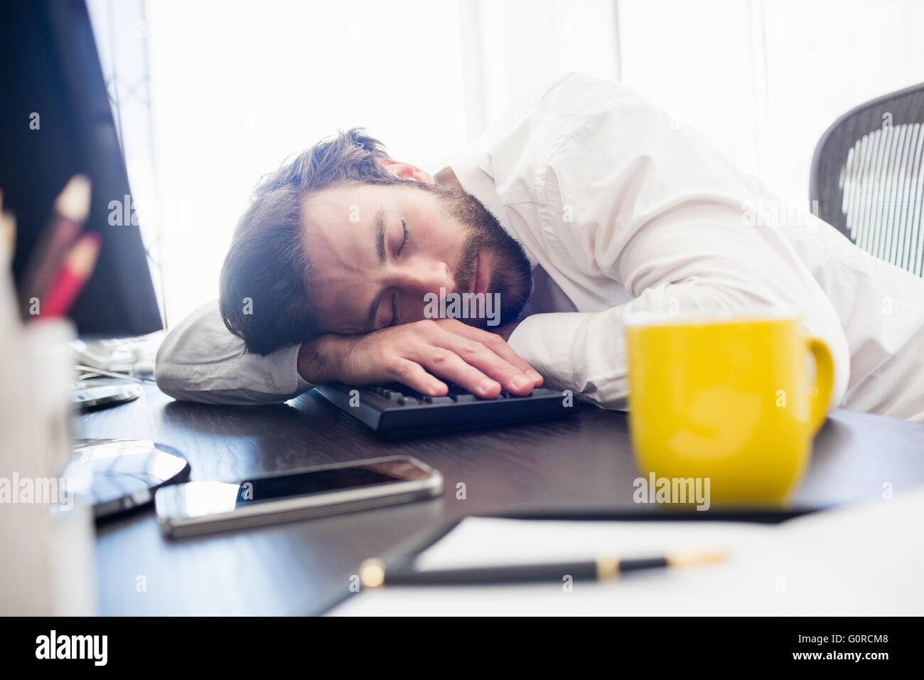 Sleeping at a desk hi-res stock photography and images - Alamy