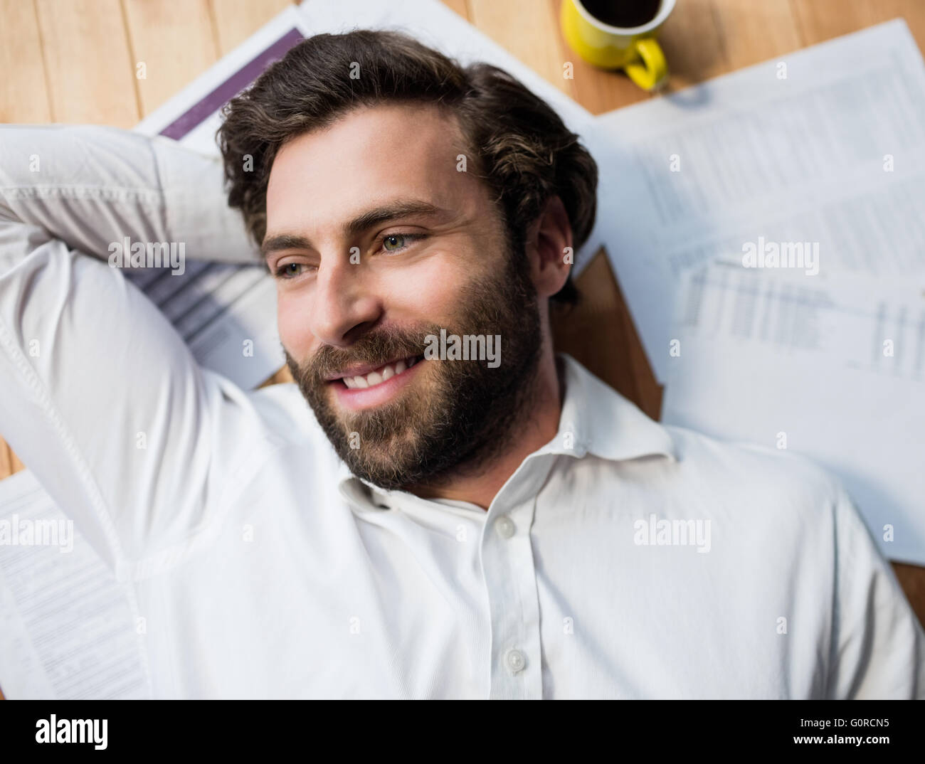 Man lying on the floor Stock Photo - Alamy