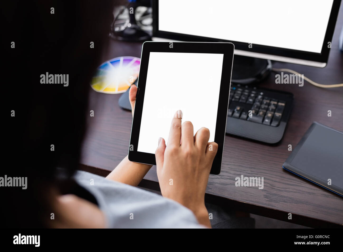 Woman watching her tablet computer Stock Photo - Alamy