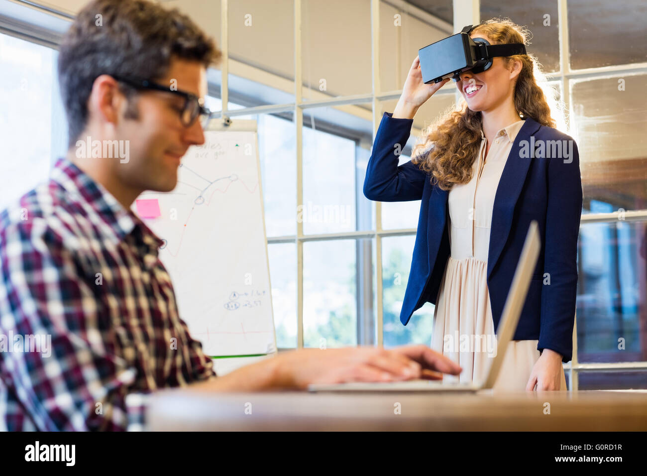 Colleagues using technology Stock Photo - Alamy