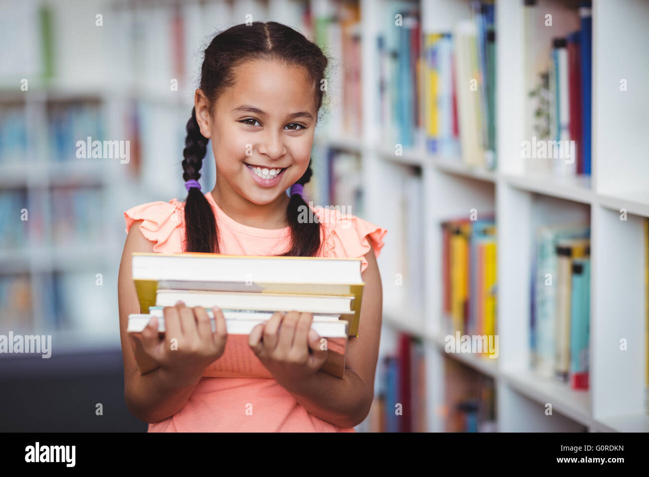Girl with books hi-res stock photography and images - Alamy