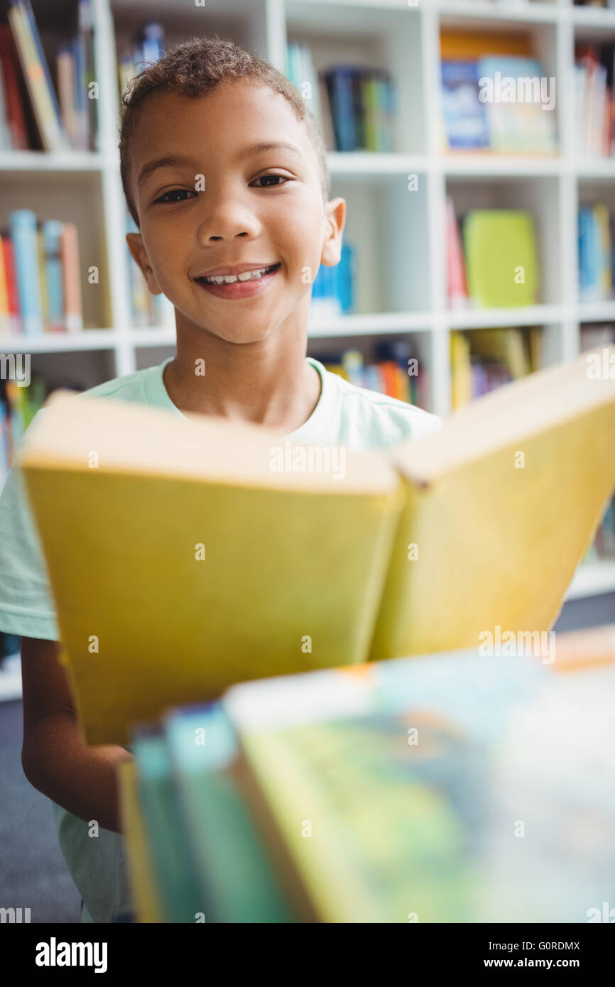 Little boy reading a book Stock Photo - Alamy
