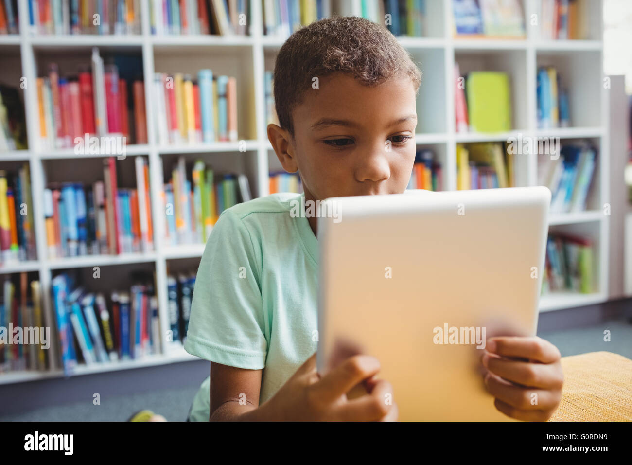 Little boy using a tablet Stock Photo - Alamy