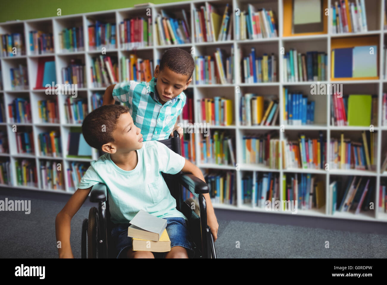 Little boys holding books Stock Photo - Alamy