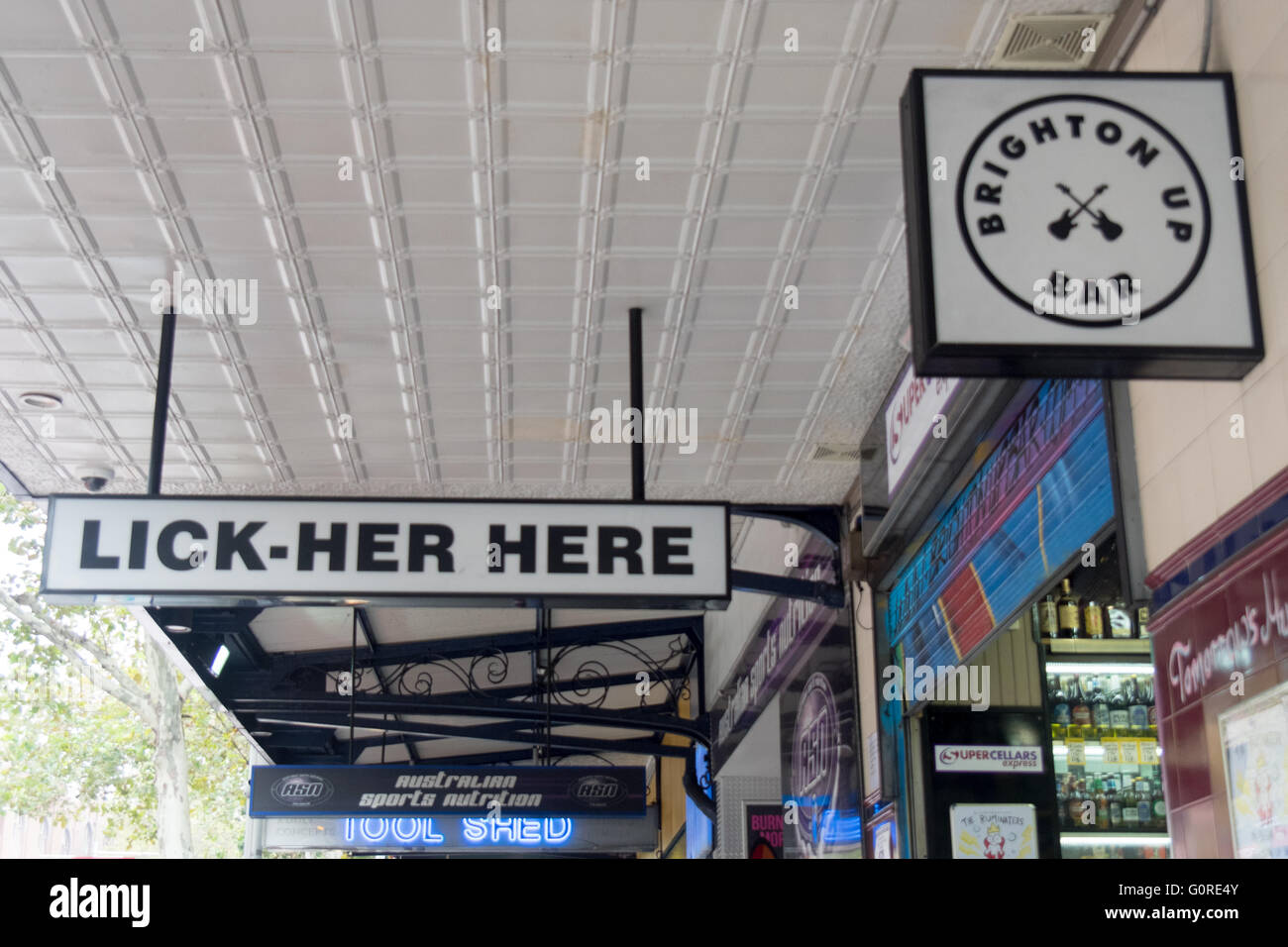 A "double entendre " sign advertising the sale of liquor Stock Photo ...