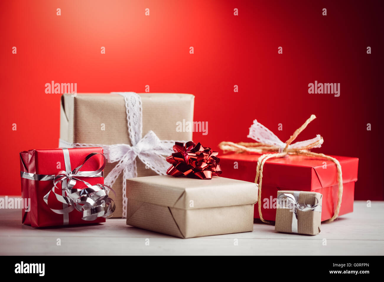 Composite image of presents on a table Stock Photo - Alamy