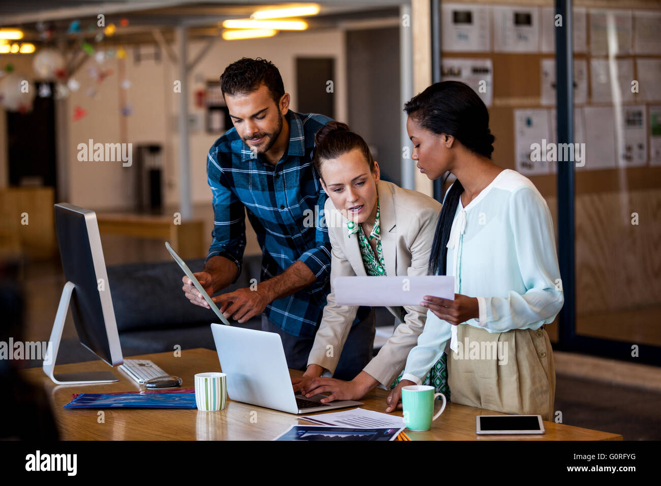 young business people working at computer desk Stock Photo - Alamy