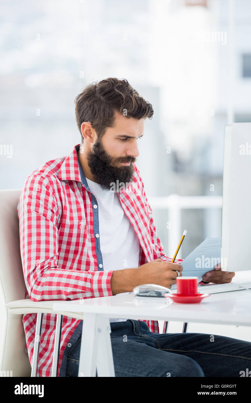 Professional man sitting desk reading hi-res stock photography and ...
