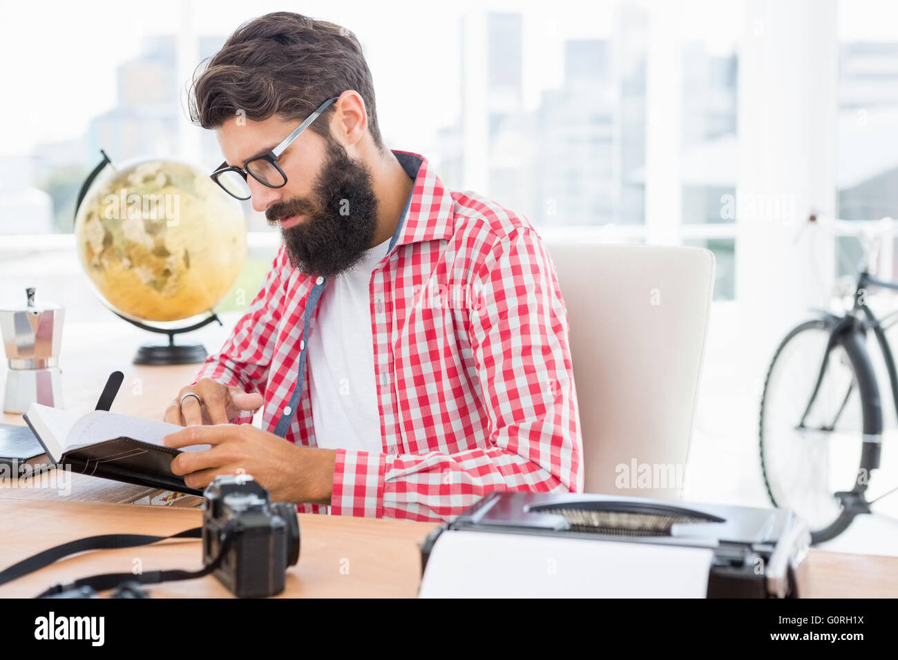 Professional man sitting desk reading hi-res stock photography and ...