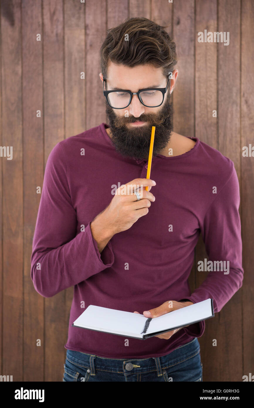 Thoughtful hipster man Stock Photo - Alamy