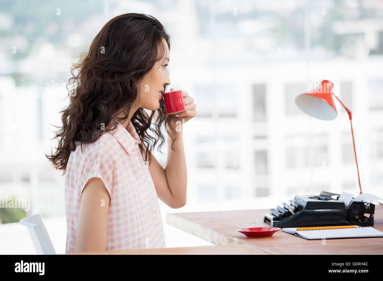 Hipster woman drinking a coffee Stock Photo - Alamy