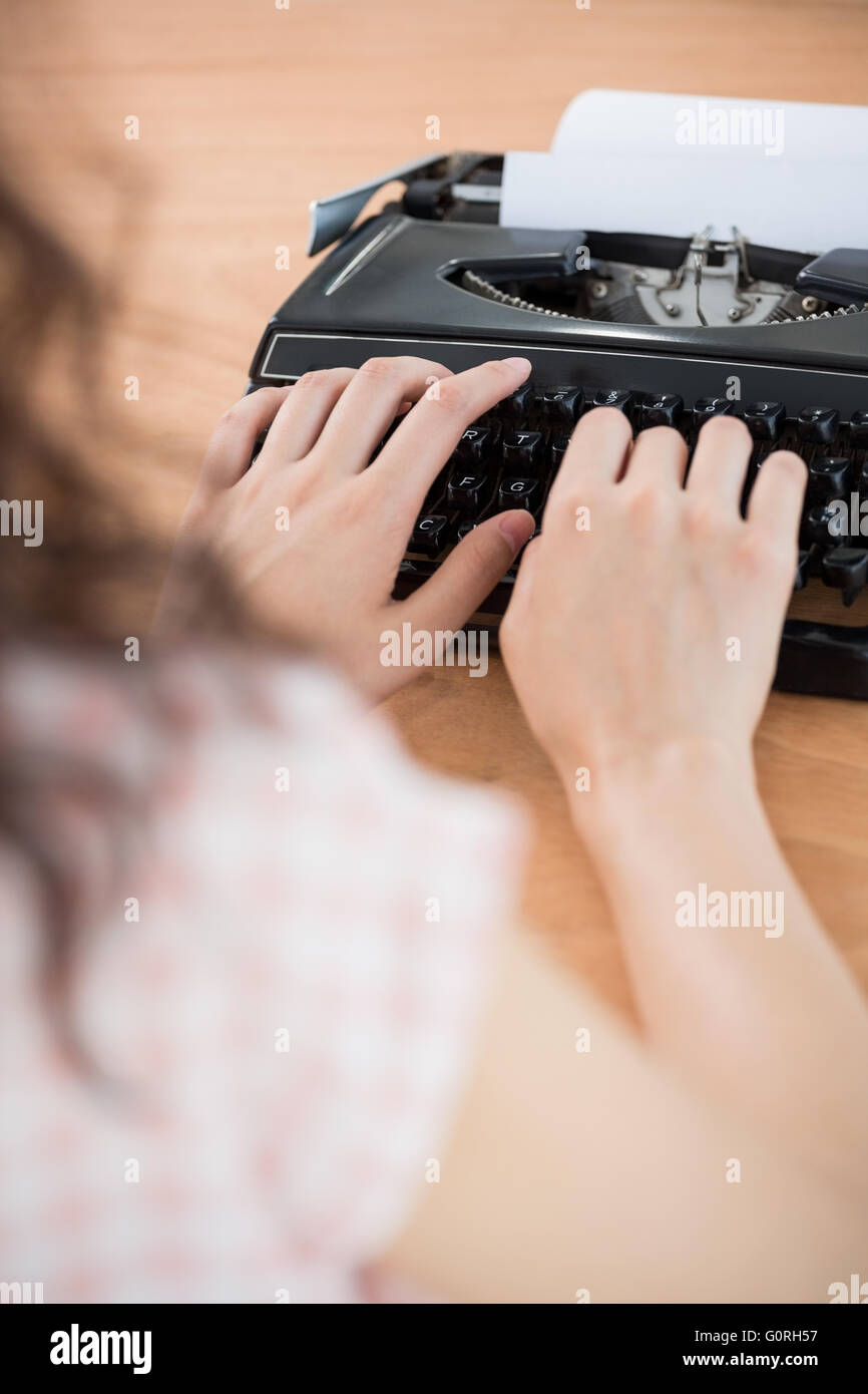 Hipster woman using a typewriter Stock Photo - Alamy