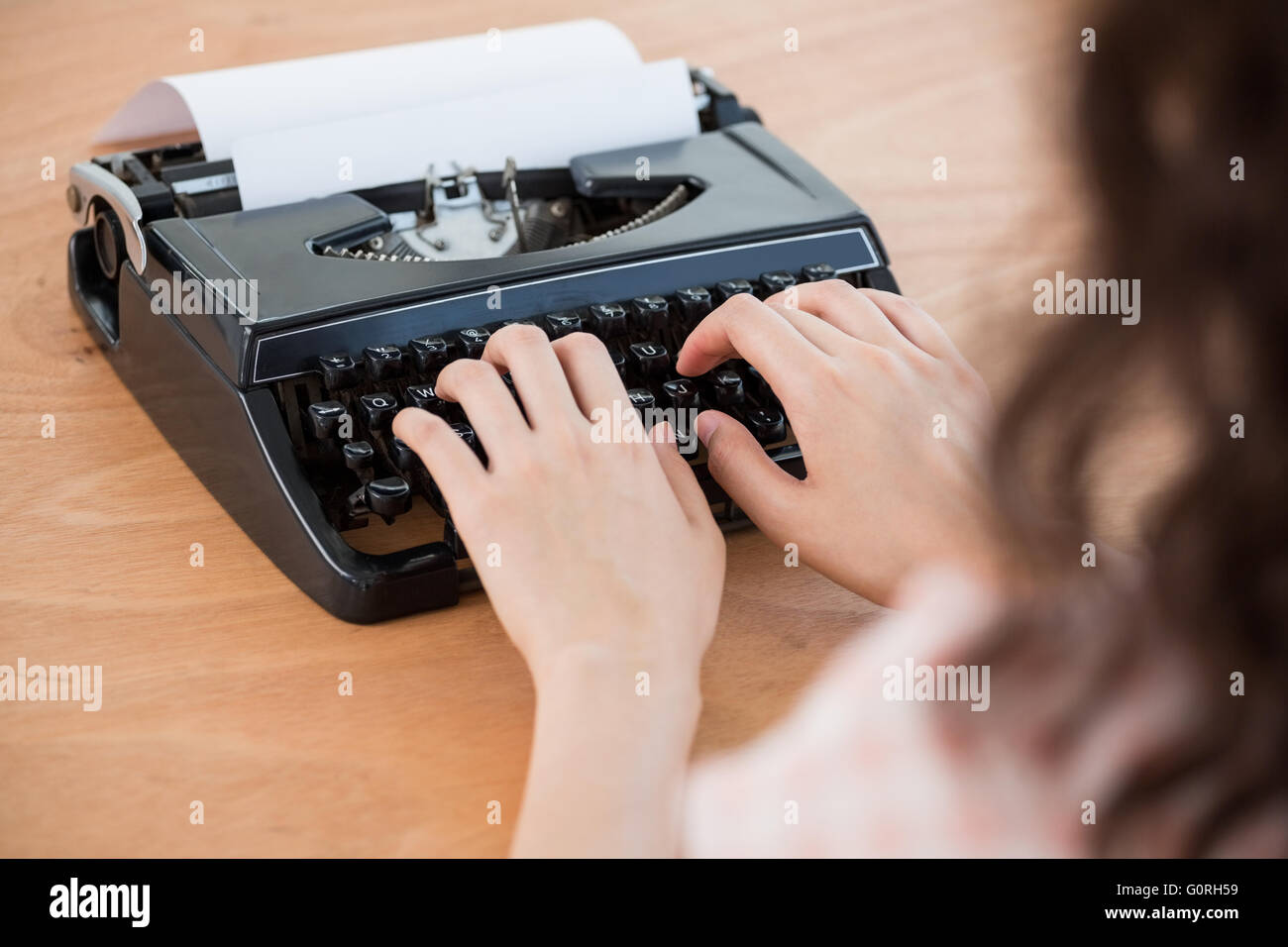 Hipster woman using a typewriter Stock Photo - Alamy