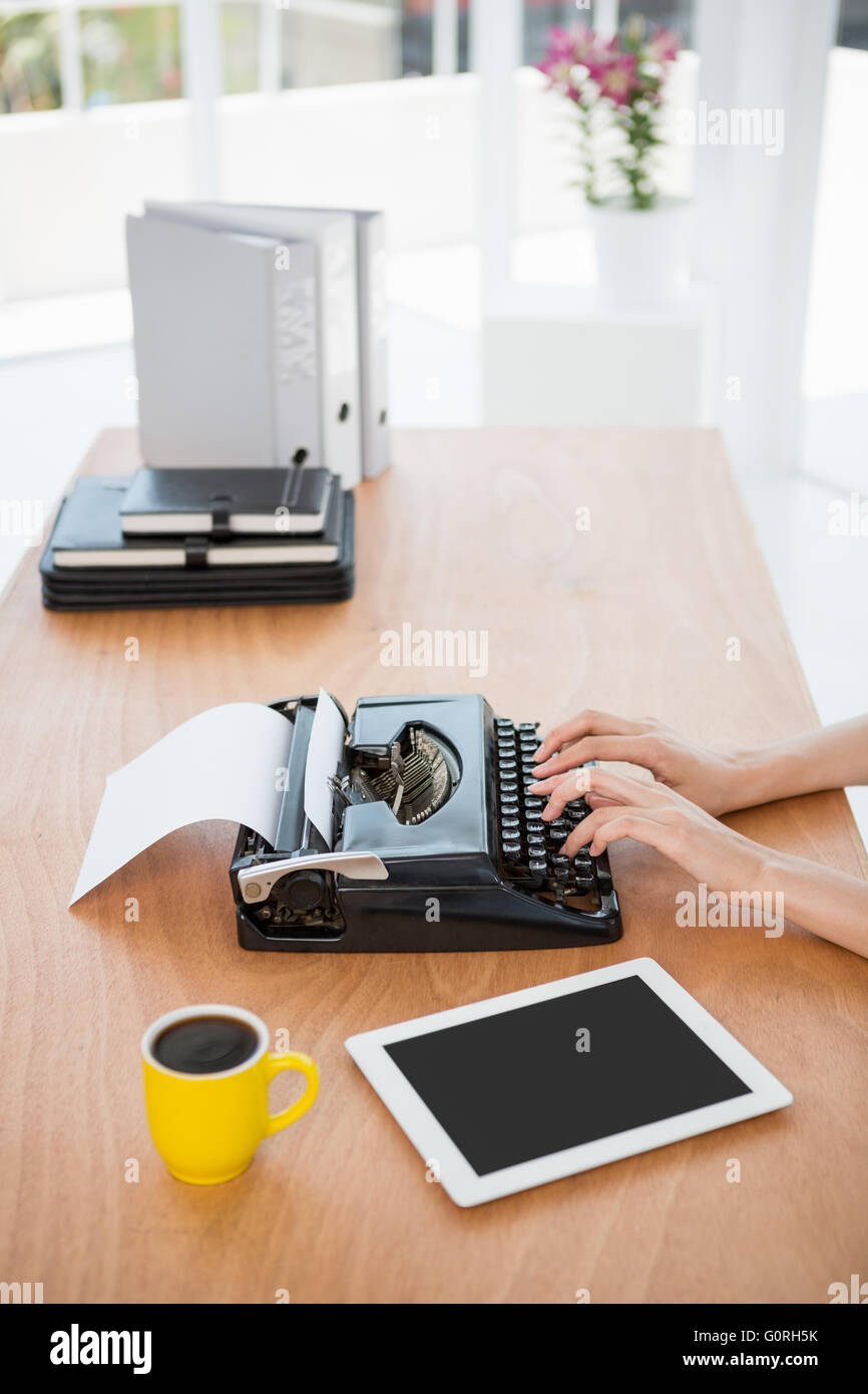 Hipster woman using a typewriter Stock Photo - Alamy