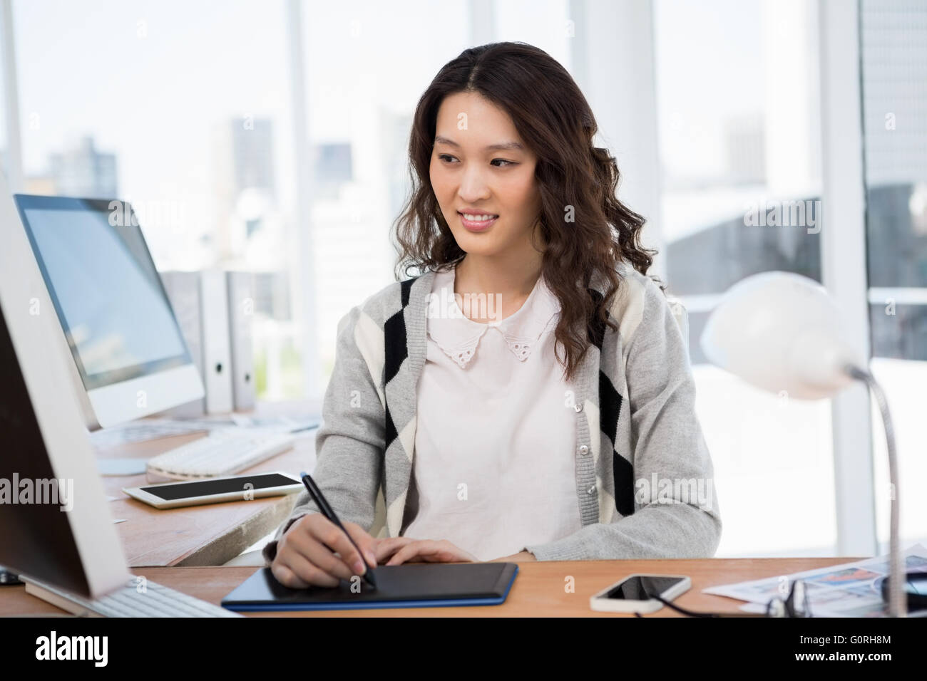 A woman is taking notes Stock Photo - Alamy
