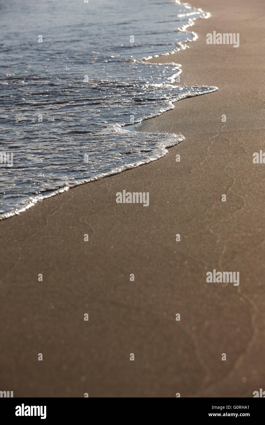 Sunset at mediterranean beach. Crete. Greece. Vertical Stock Photo - Alamy
