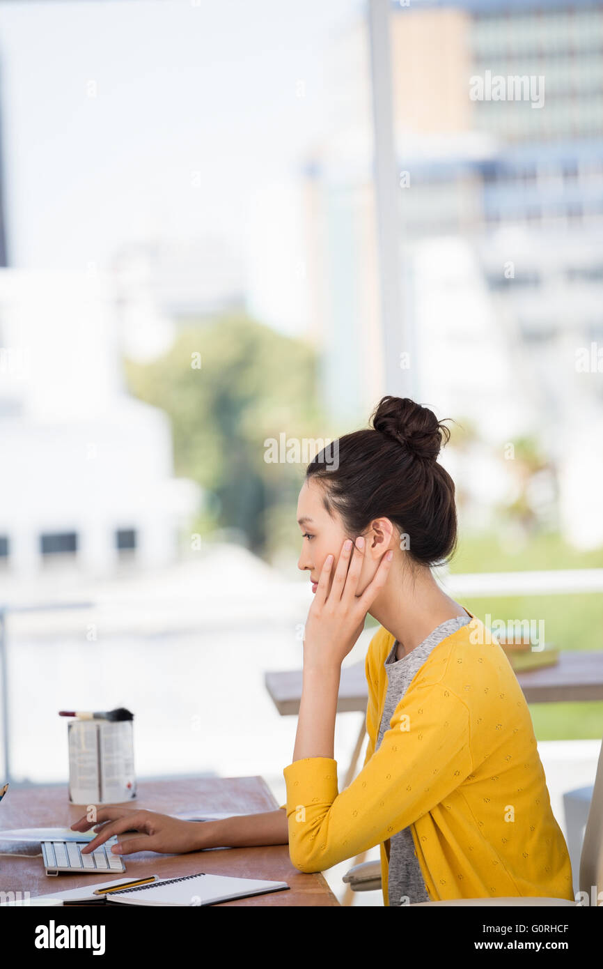 Side view of a working girl Stock Photo - Alamy