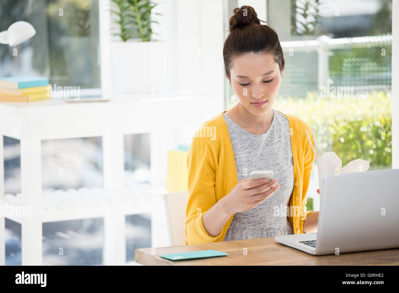 hipster girl is using her phone Stock Photo - Alamy