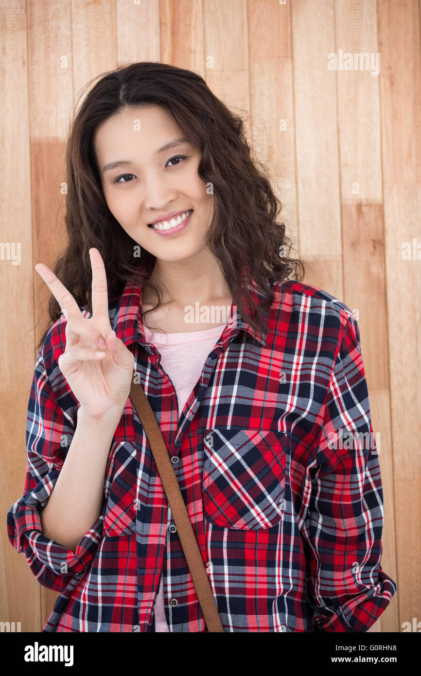 Man smiling peace sign hi-res stock photography and images - Alamy