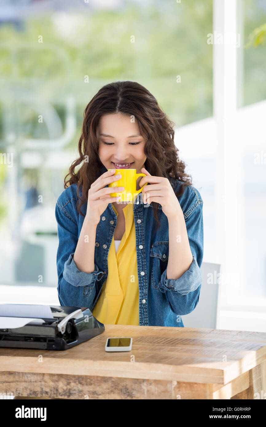 Hipster drinking coffee Stock Photo - Alamy