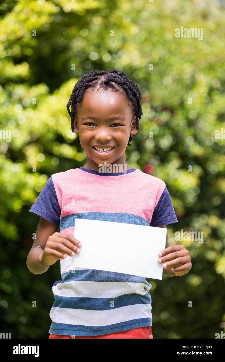 A little boy is holding a poster Stock Photo - Alamy