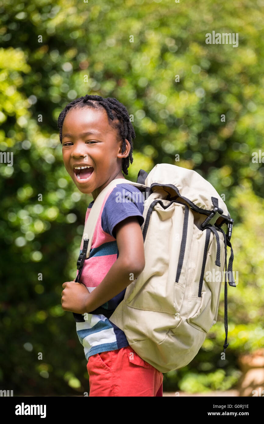 Smiling boy carrying backpack Stock Photo - Alamy