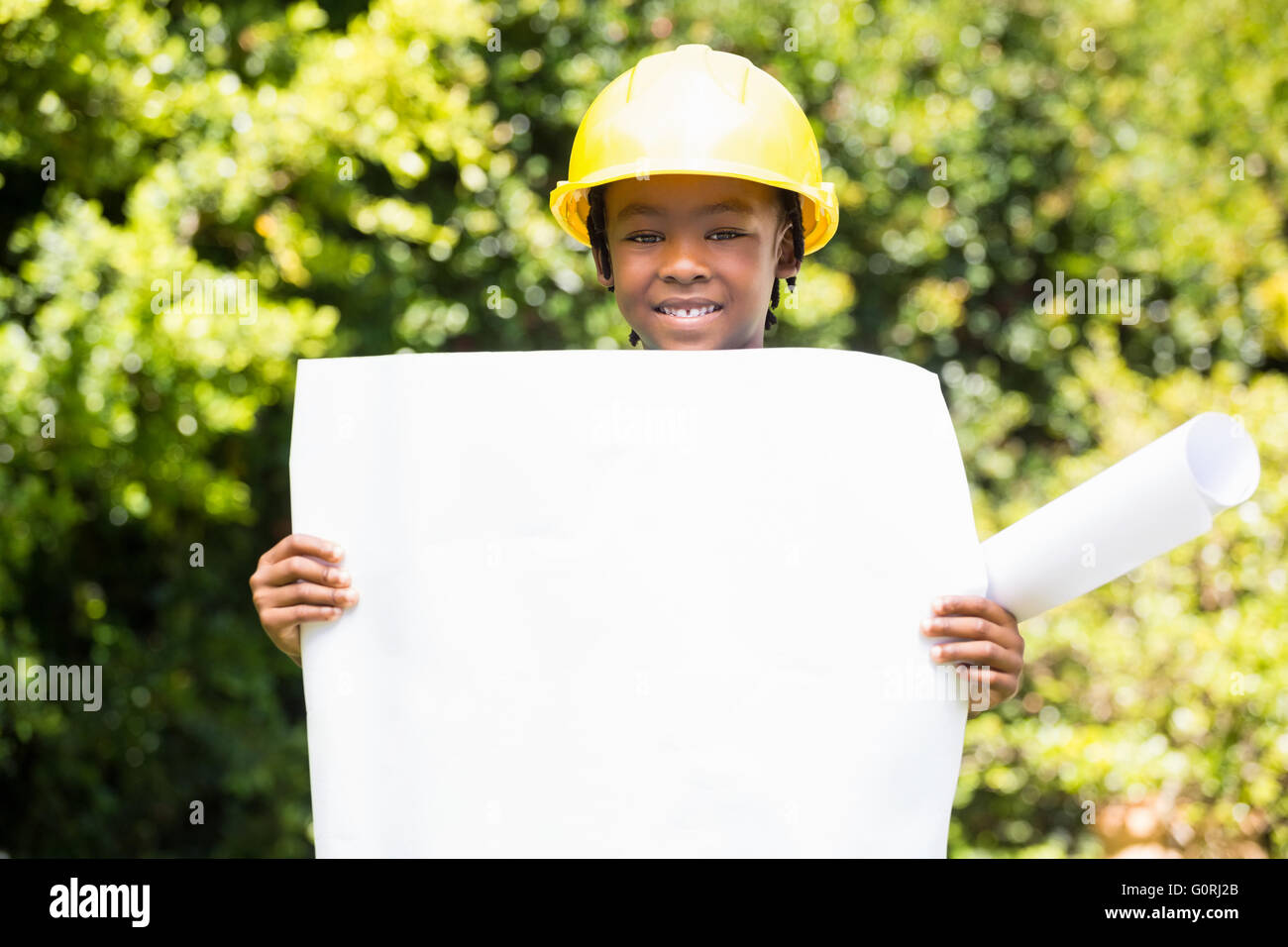 Boy dressed as an architect holding a plan Stock Photo - Alamy