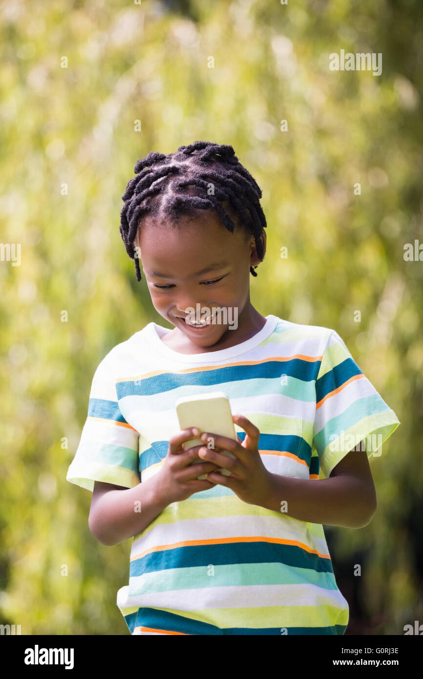 A kid playing with a mobile phone Stock Photo - Alamy