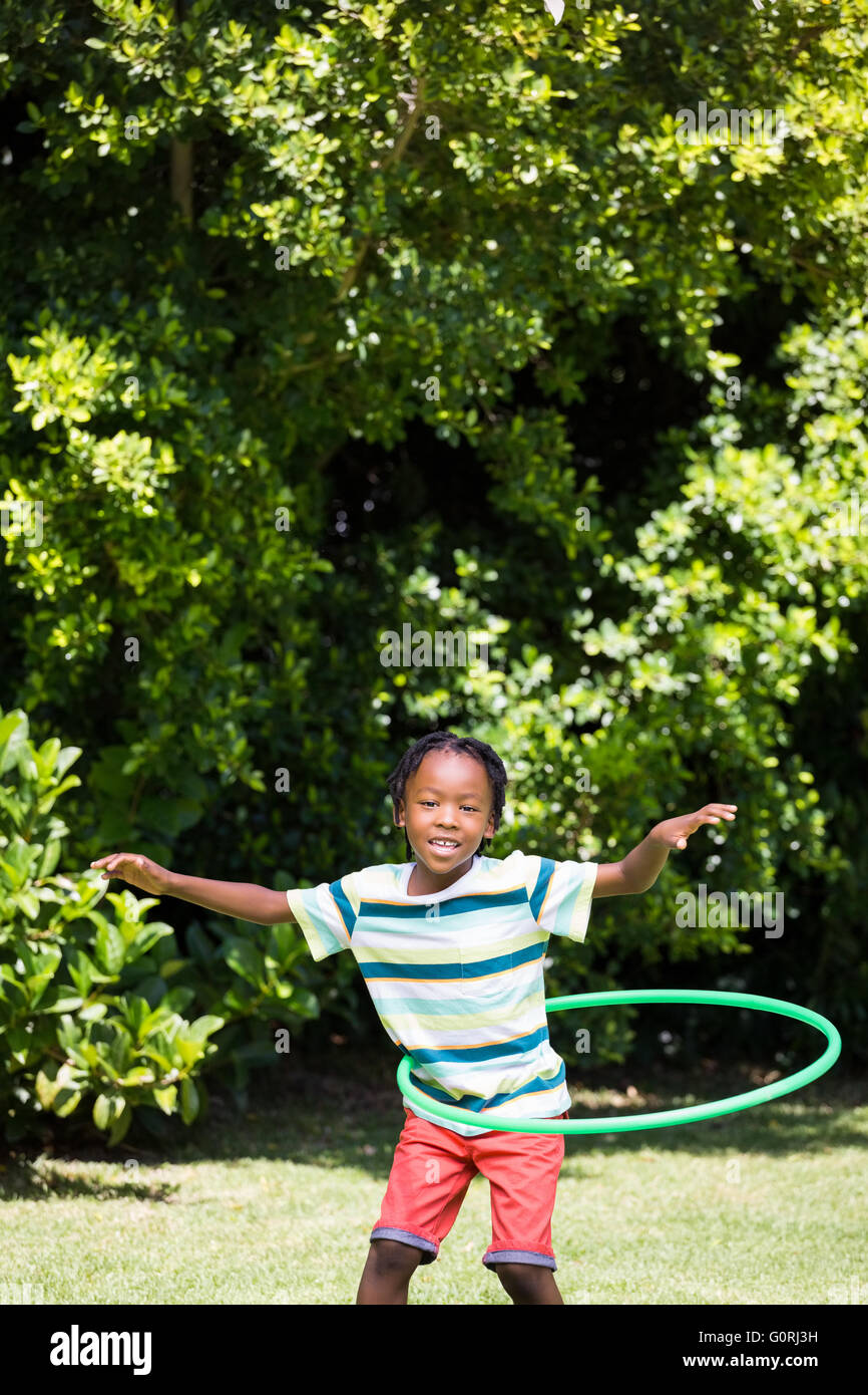 A kid playing with a hoop Stock Photo - Alamy