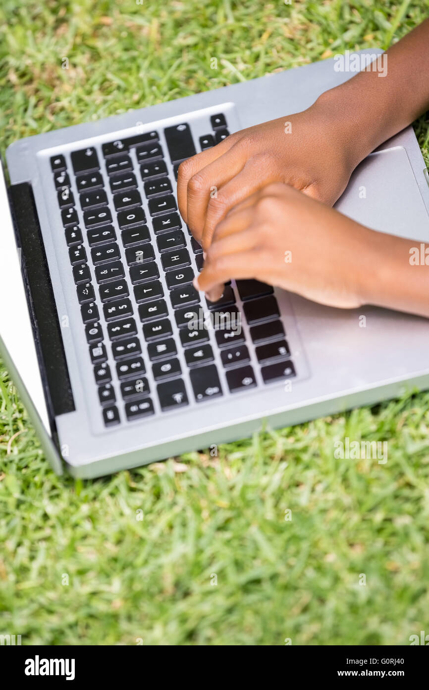 Kid typing laptop hi-res stock photography and images - Alamy
