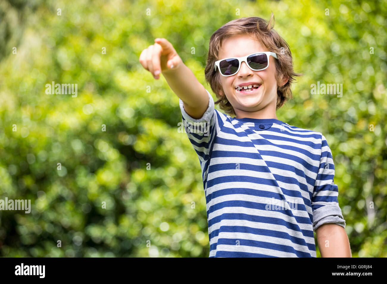 Boy pointing at sign hi-res stock photography and images - Alamy