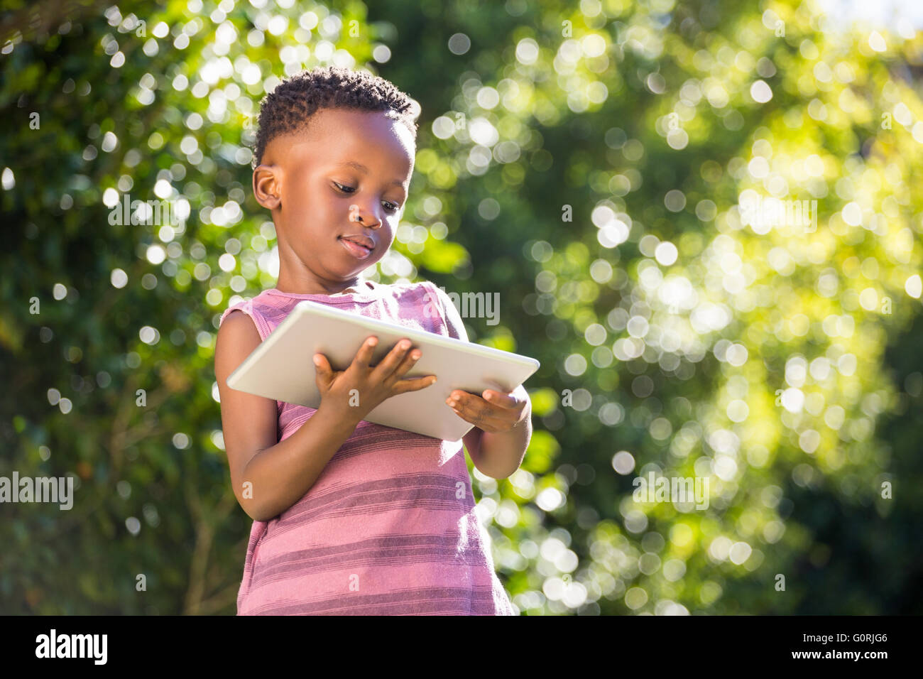 A child is using a pad Stock Photo - Alamy