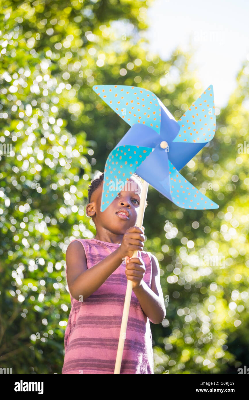 Boy playing with a pinwheel Stock Photo - Alamy