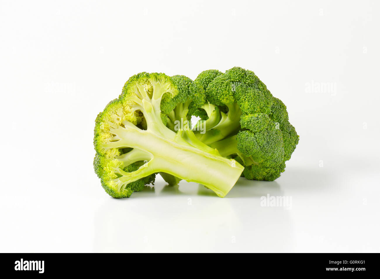 Fresh broccoli - one whole head and half Stock Photo - Alamy