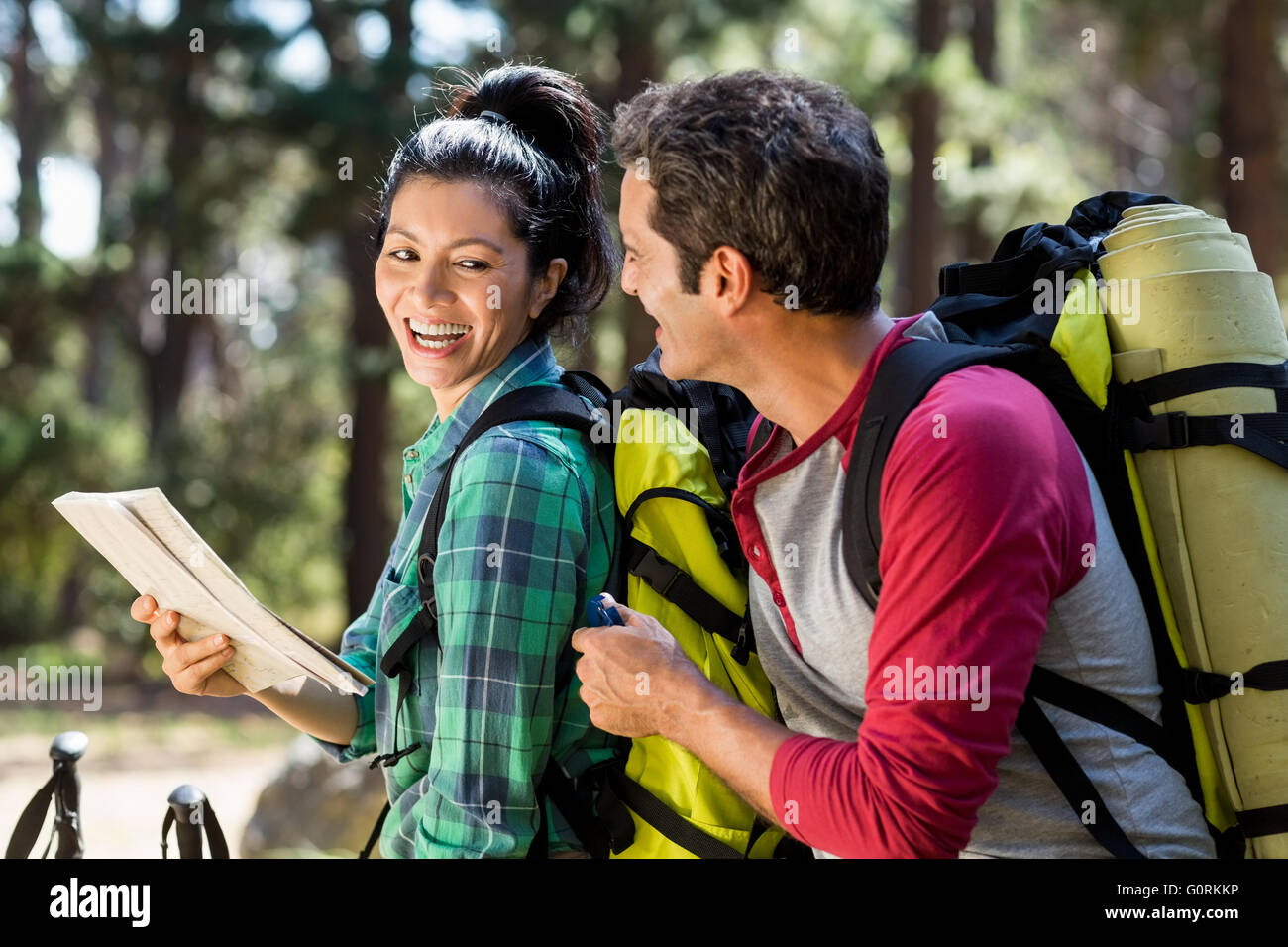 Couple smiling and hiking Stock Photo - Alamy