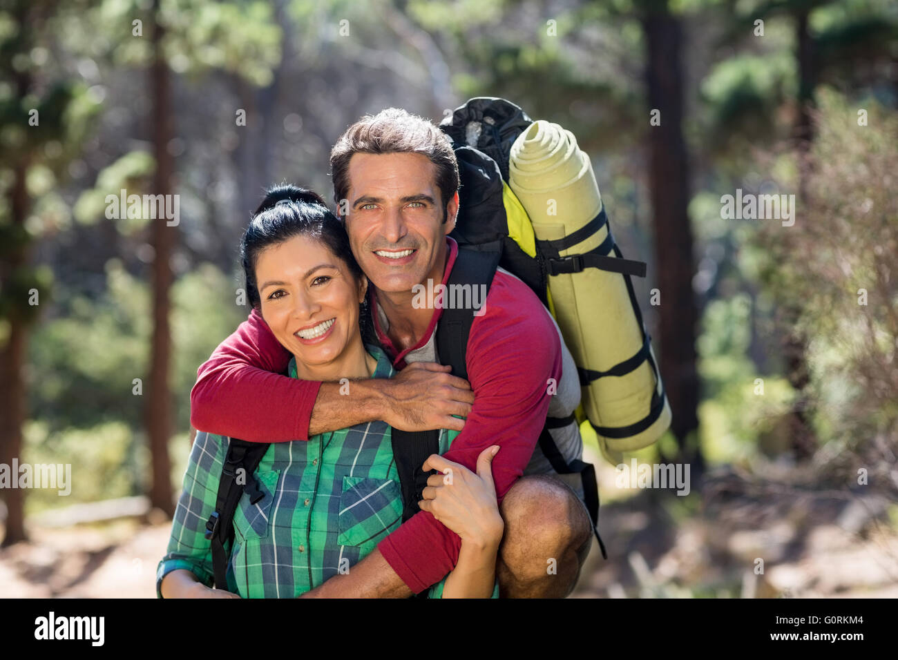 Couple smiling and holding each other Stock Photo - Alamy