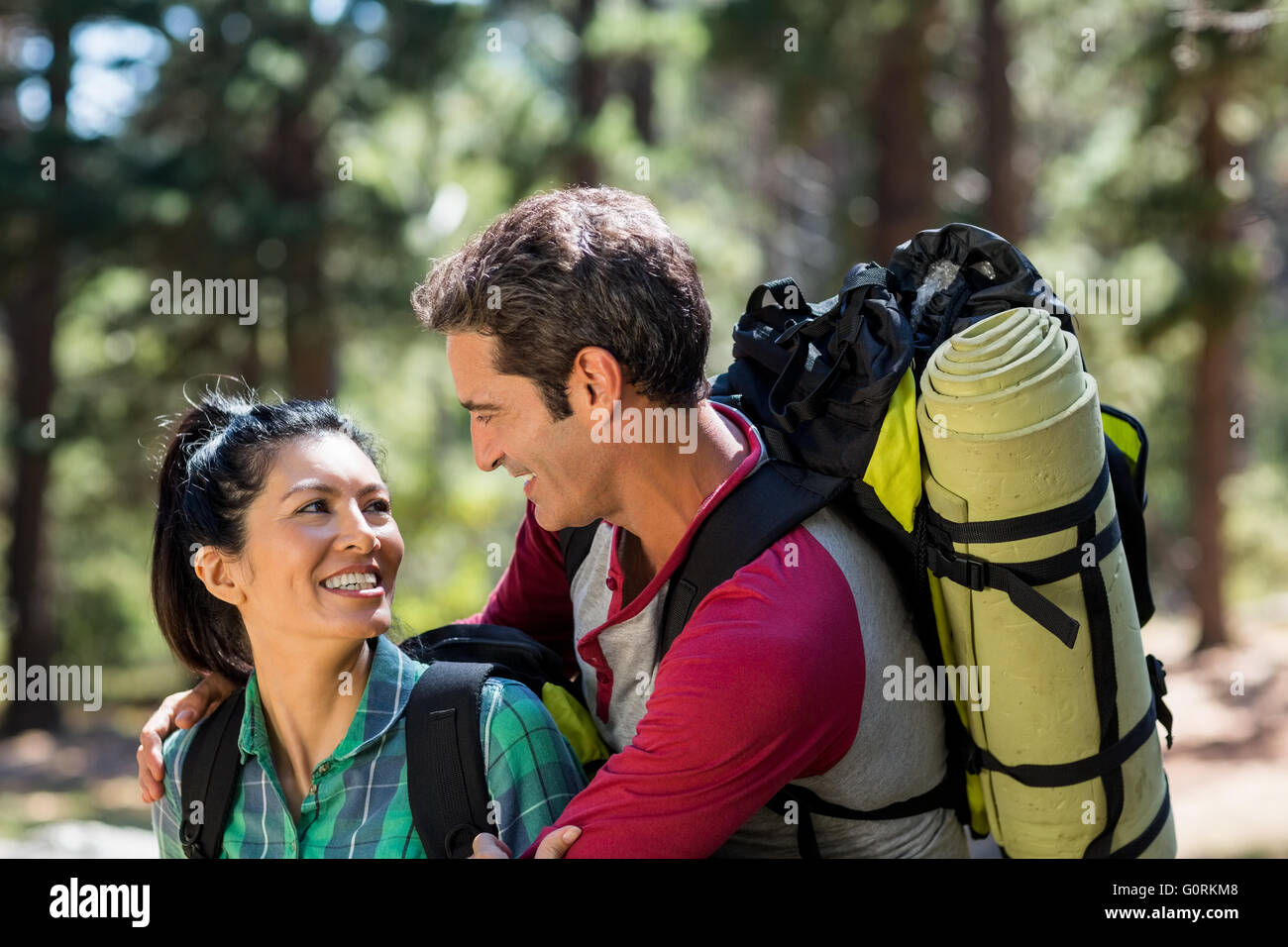 Smiling couple hiking Stock Photo - Alamy