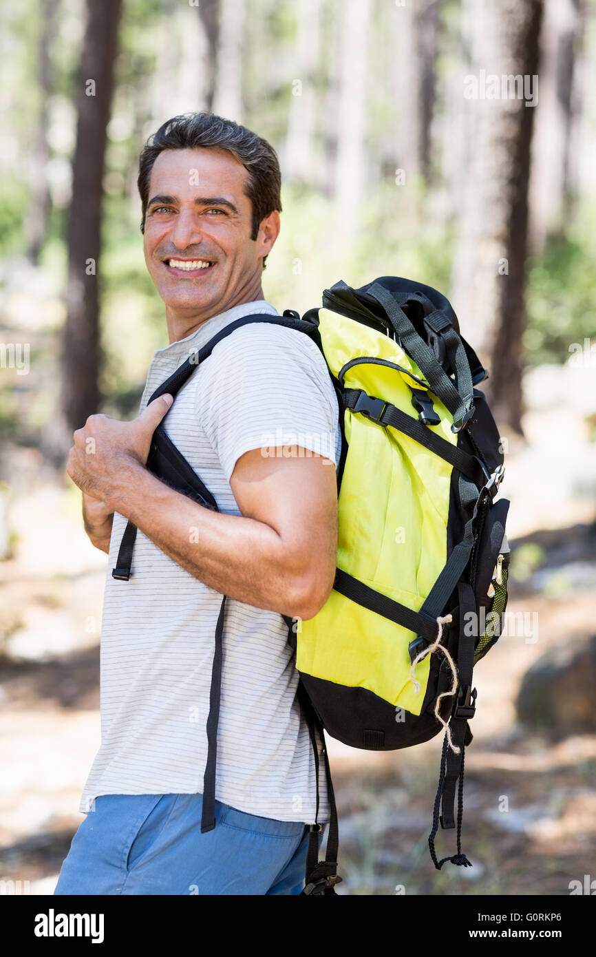 Man smiling and posing with his backpack Stock Photo - Alamy