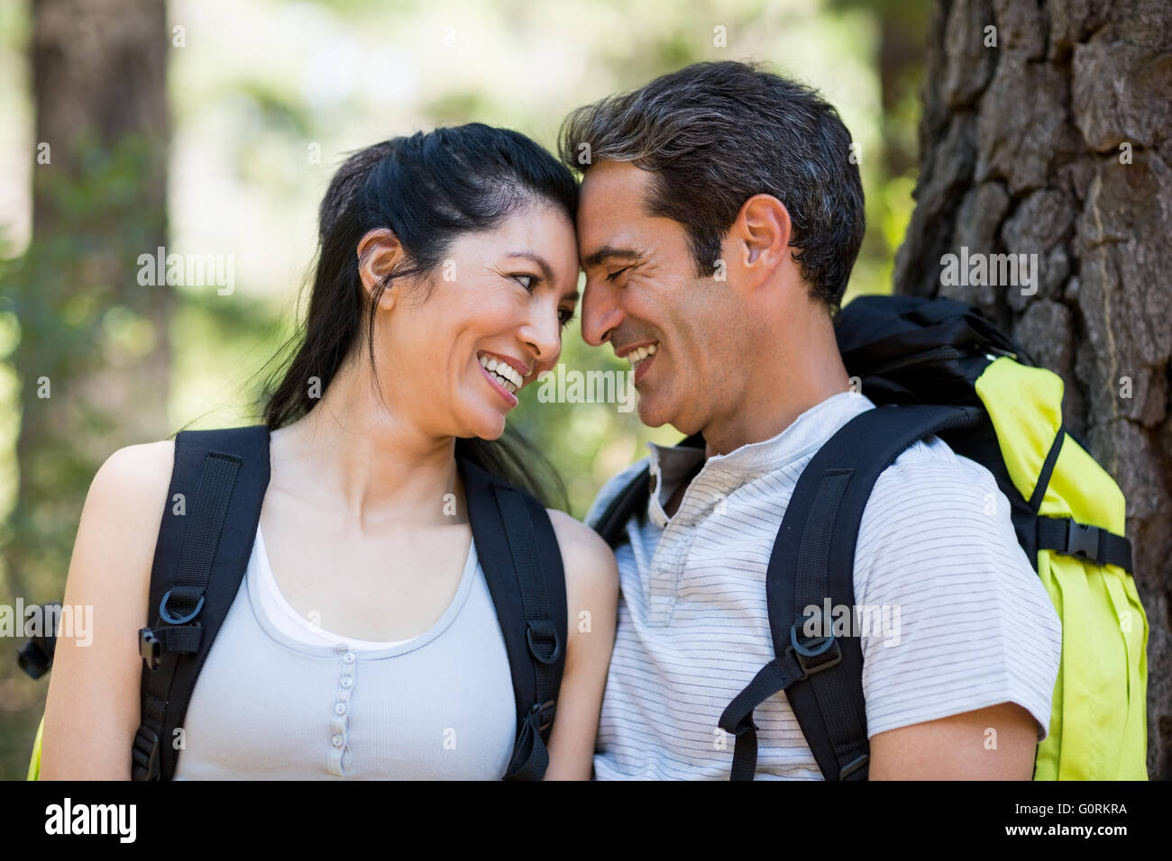 Couple smiling and holding each other Stock Photo - Alamy