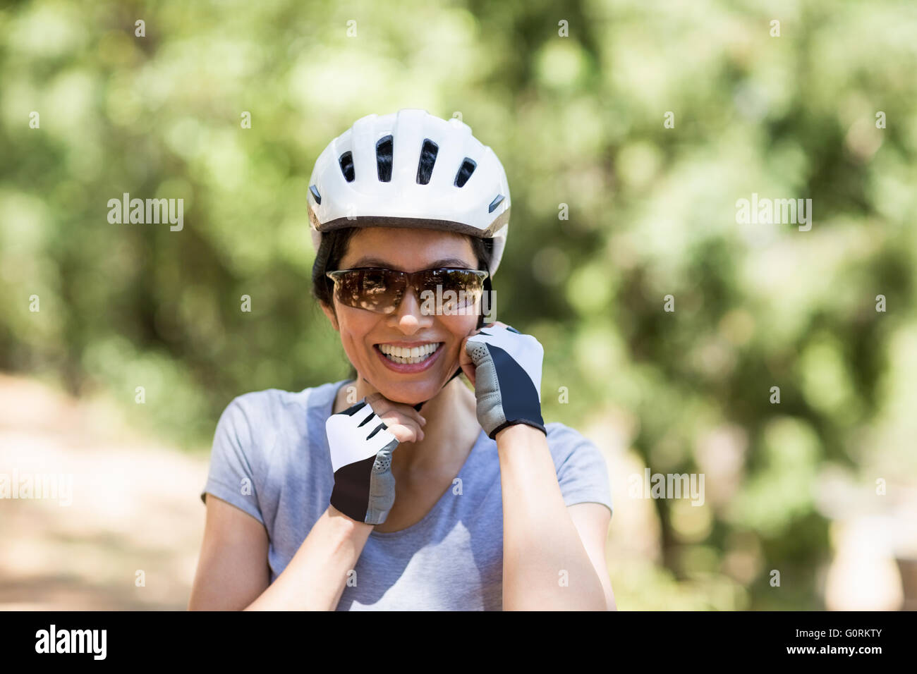 Portrait of a woman bike rider smiling Stock Photo - Alamy